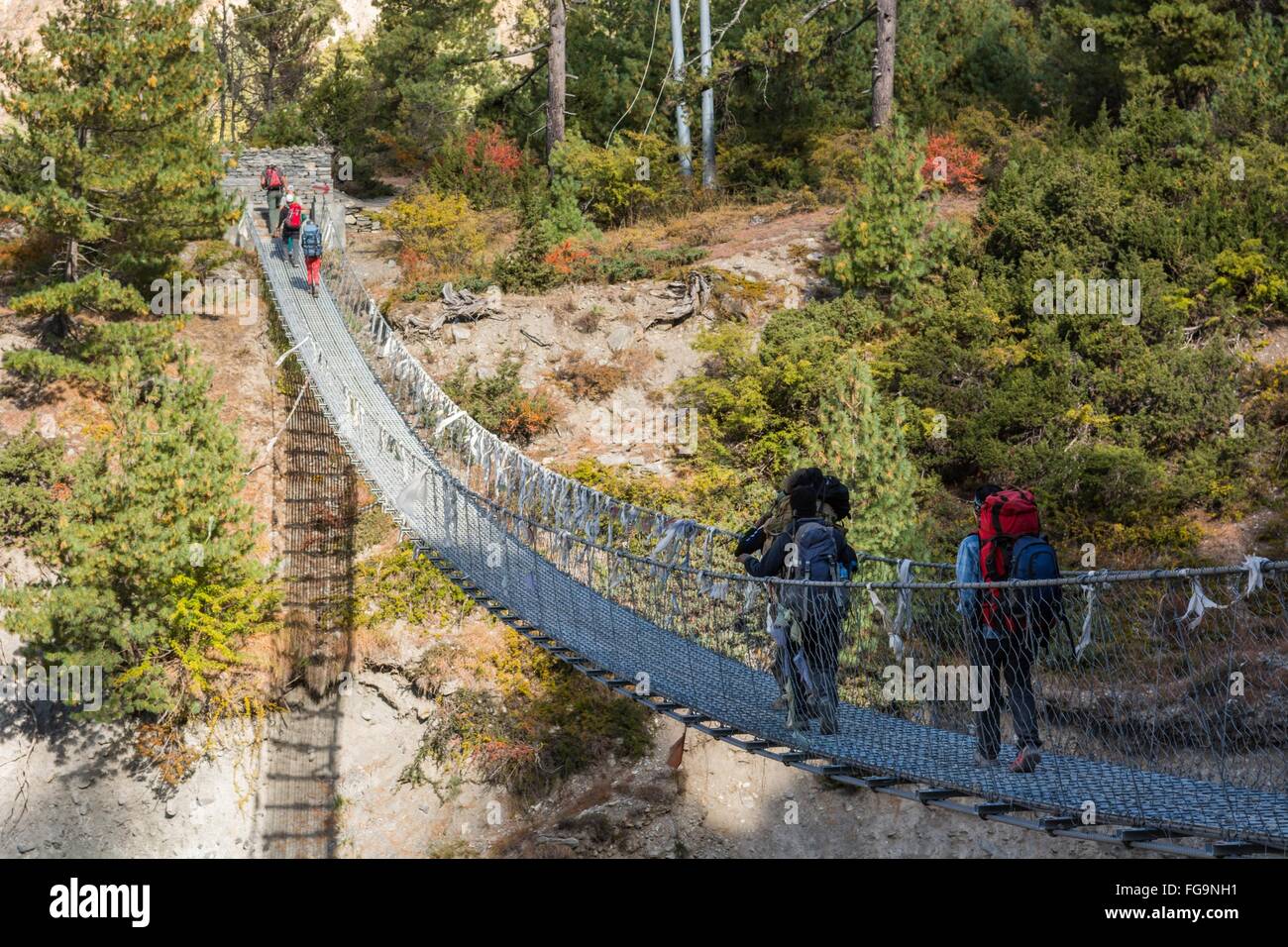 Trekkers crossing a bridge hi-res stock photography and images - Alamy