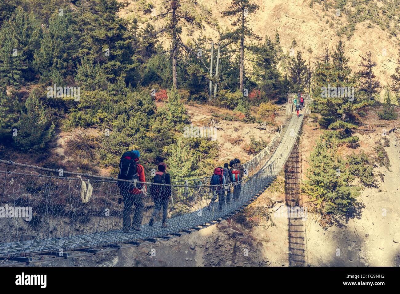 Trekkers crossing a bridge hi-res stock photography and images - Alamy