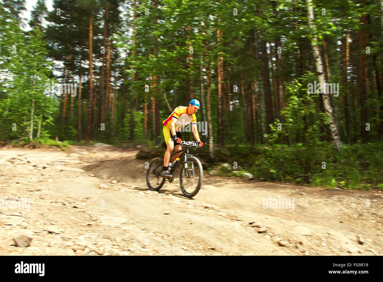 man riding a mountain bike Stock Photo - Alamy