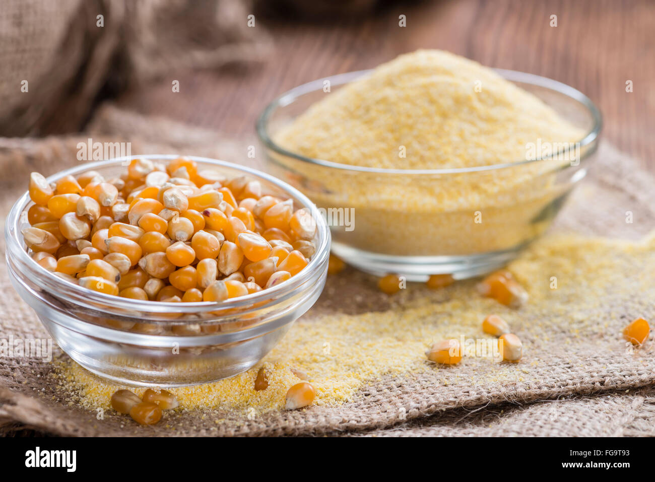 Portion of Cornmeal (on rustic background) as detailed close-up shot ...