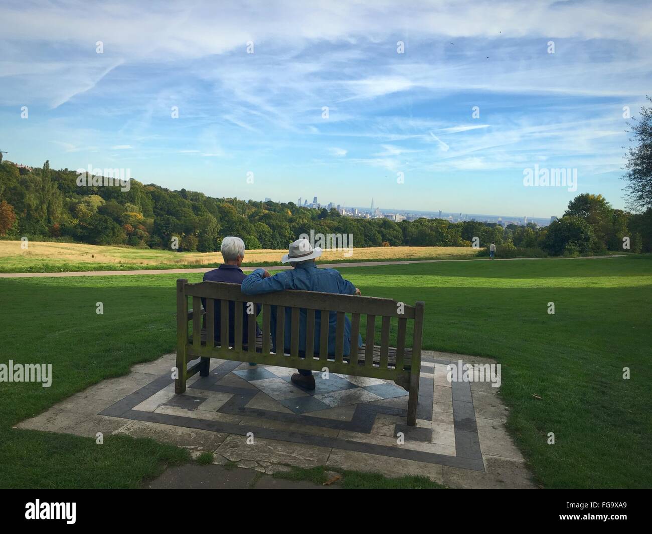 Sitting on bench rear view hi-res stock photography and images - Alamy