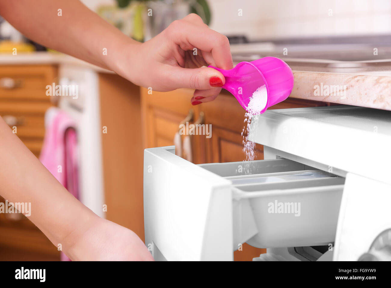 Woman washing blue garment hi-res stock photography and images - Alamy