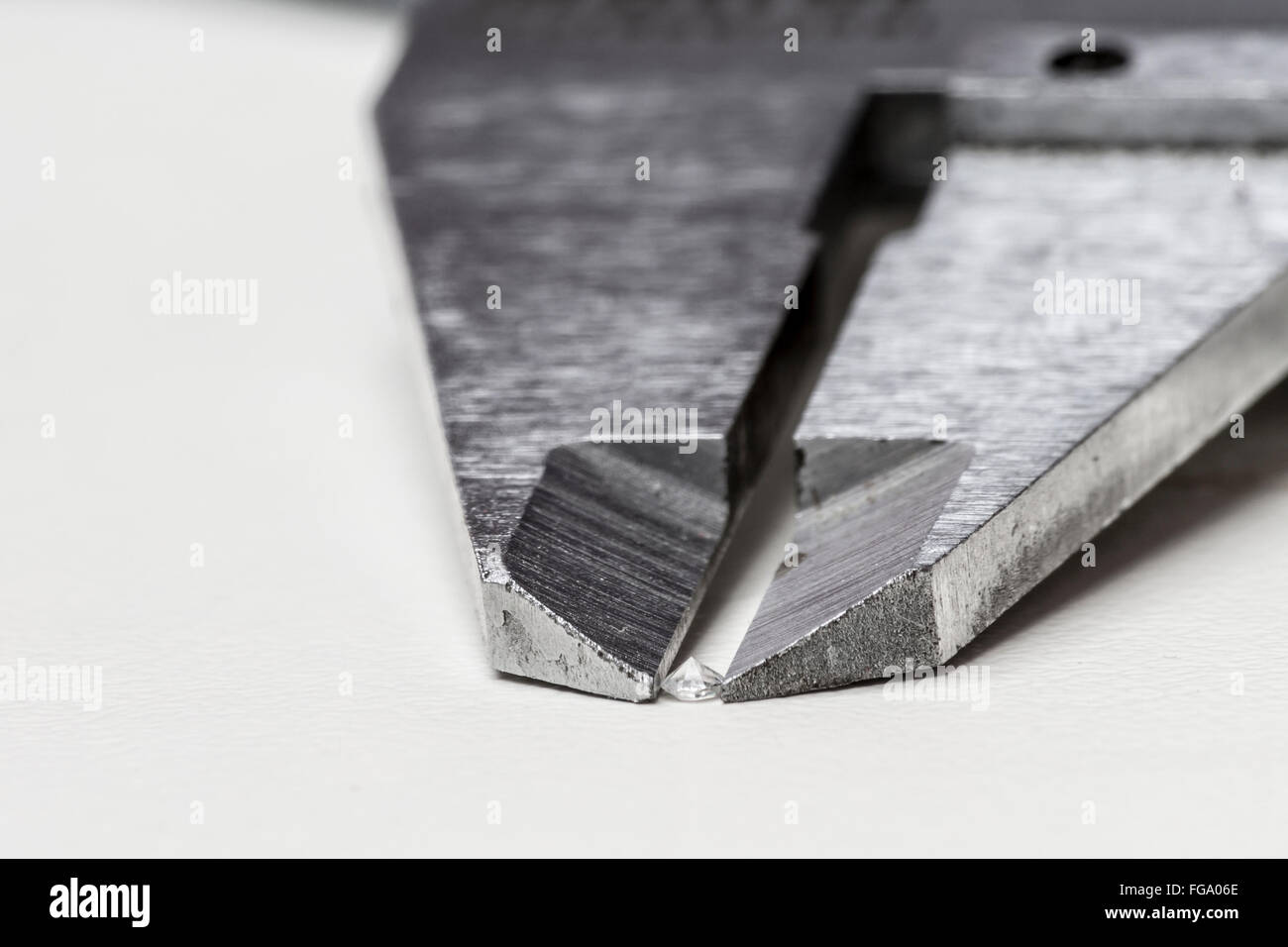 Measuring a small Diamond with a Vernier Caliper Stock Photo - Alamy