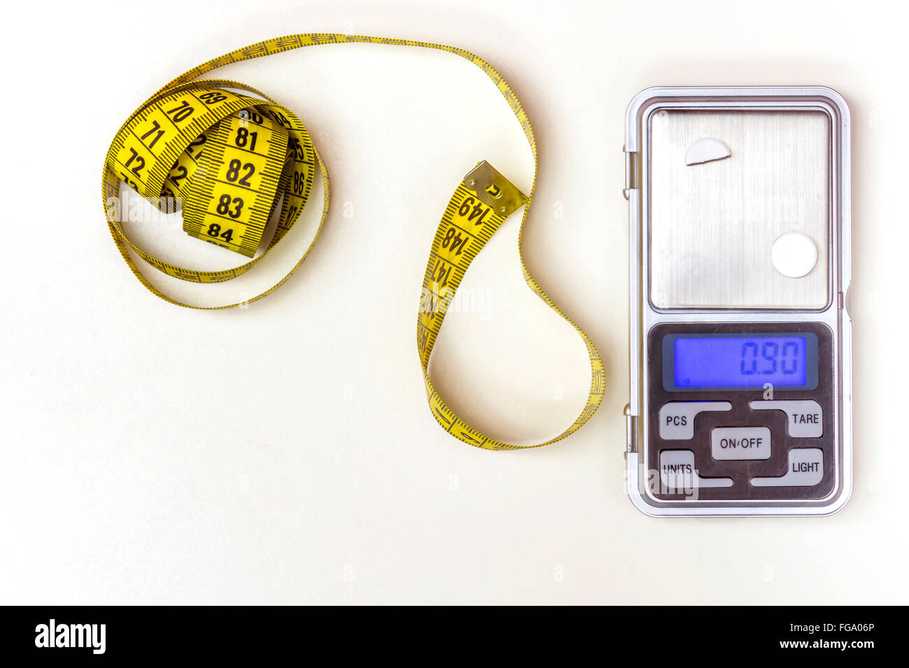 Measuring Tape and a Medicine Scale on a white background Stock Photo ...