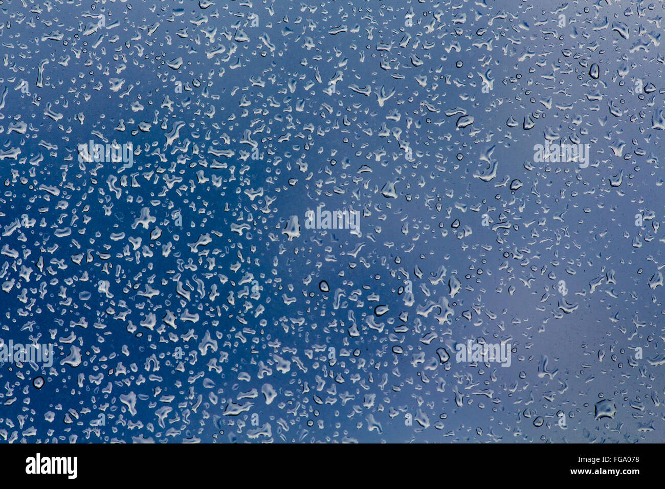 Water drops on a window with the night sky in the background Stock ...