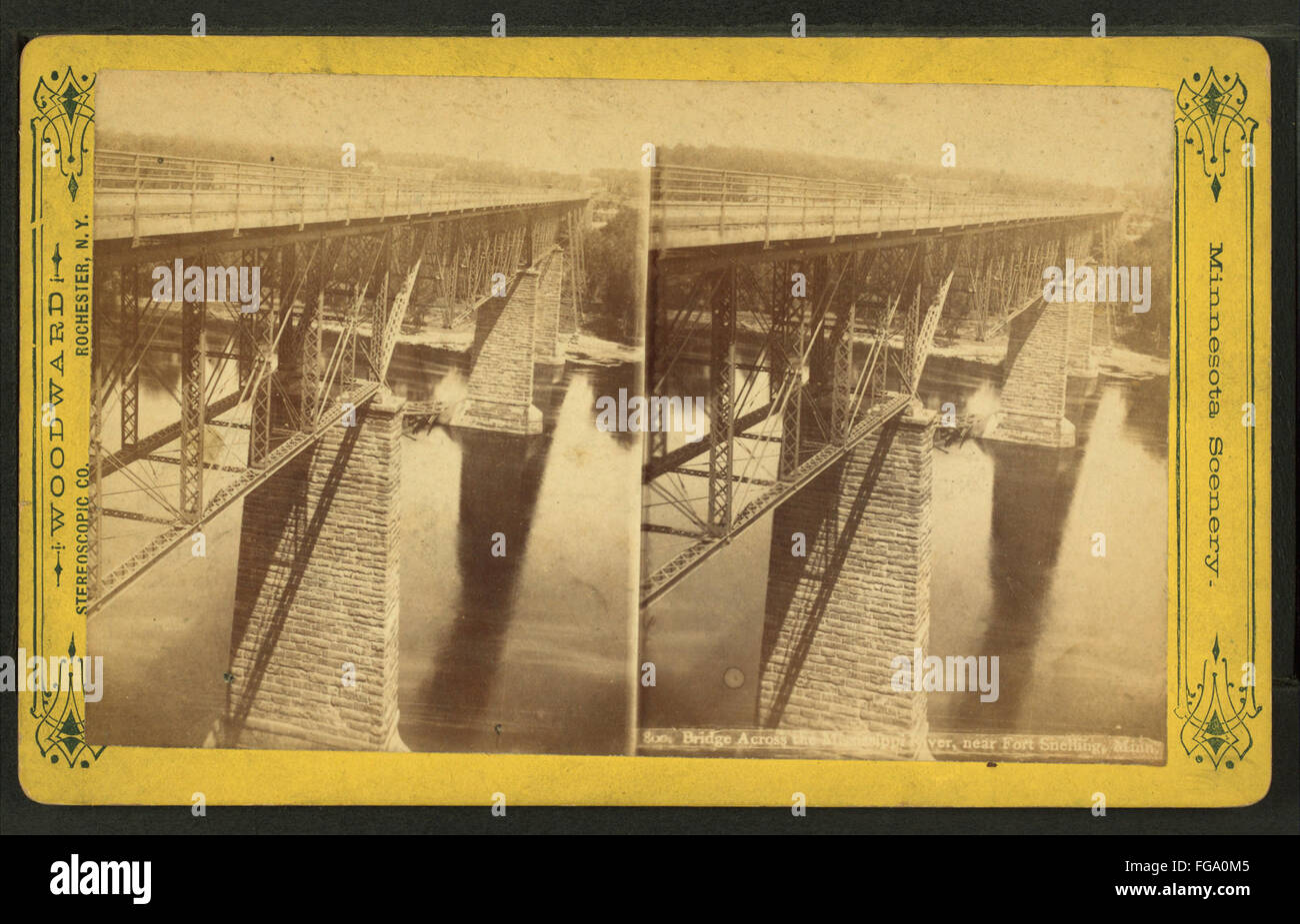 This historic photograph shows a bridge spanning the Mississippi River ...