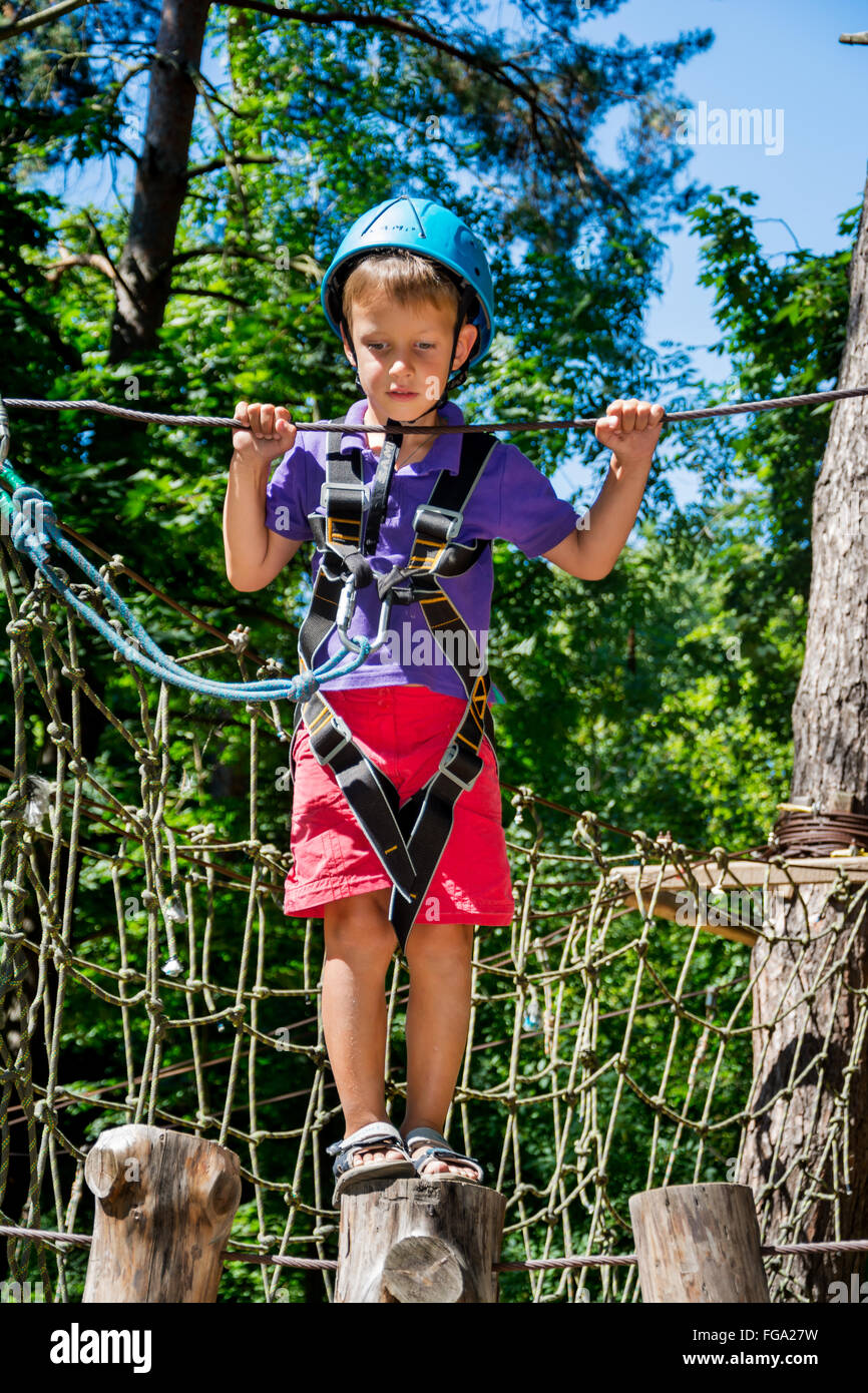 Five year boy on rope-way in forest Stock Photo - Alamy