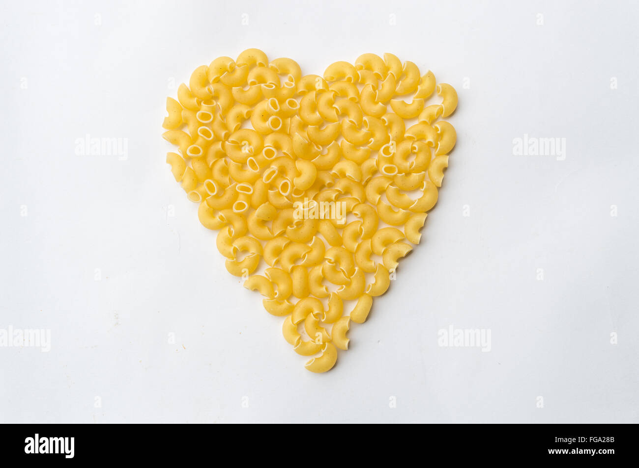 Pasta macaroni isolated on white background in a heart shape Stock ...