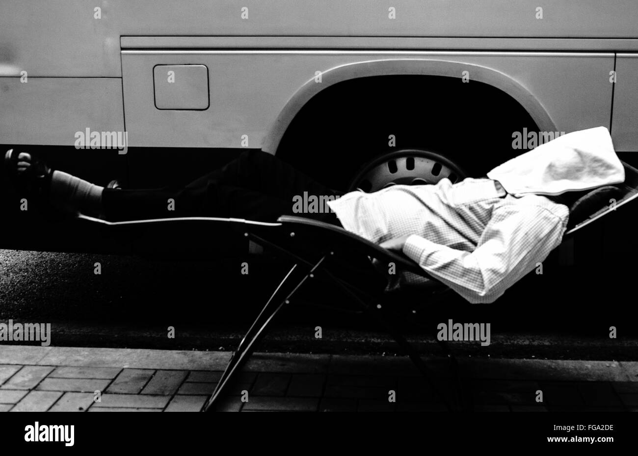 Man sleeping on chair hi-res stock photography and images - Alamy