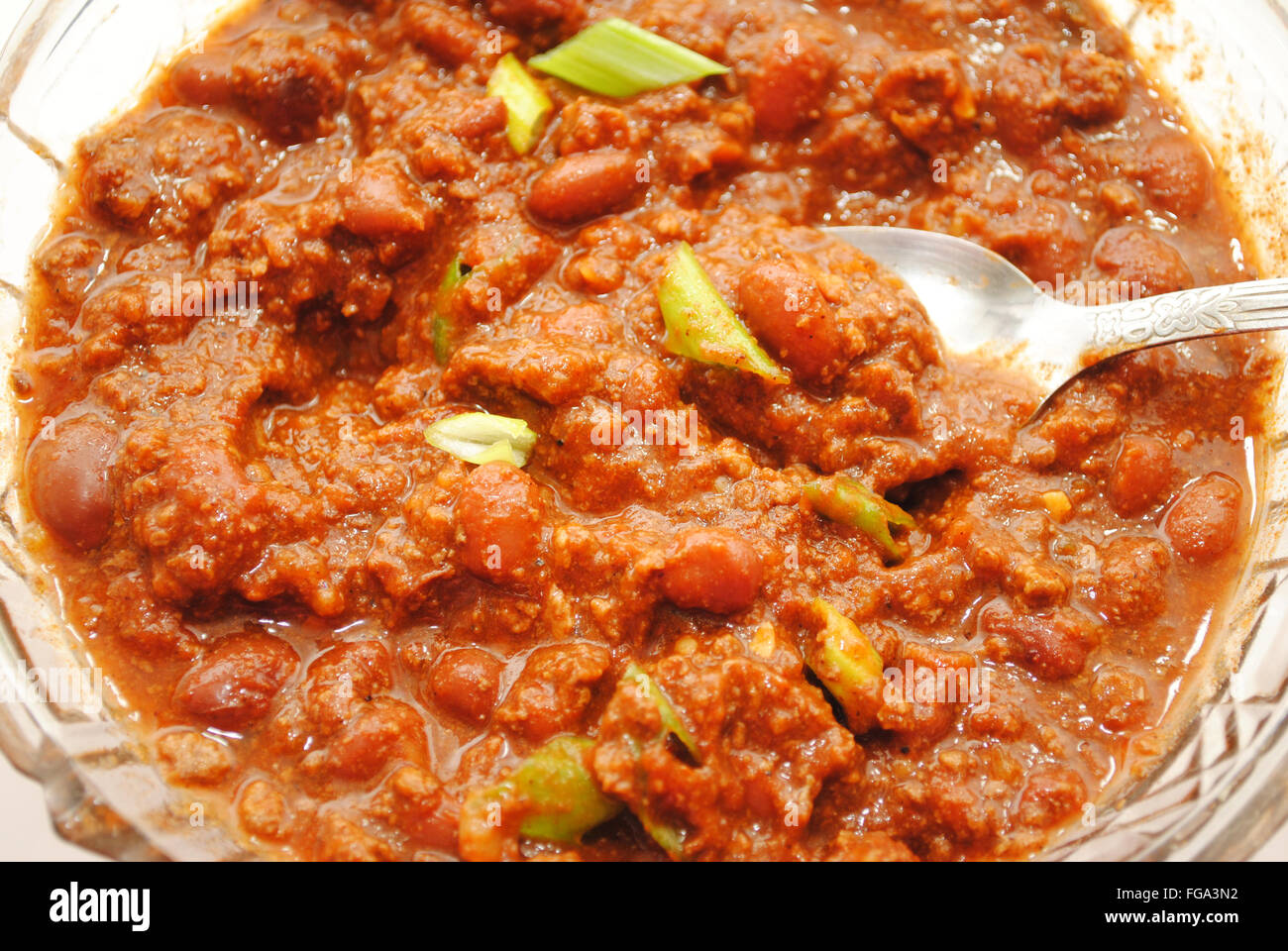 Eating a Bowl of Hot and Spicy Mexican Chili Stock Photo - Alamy