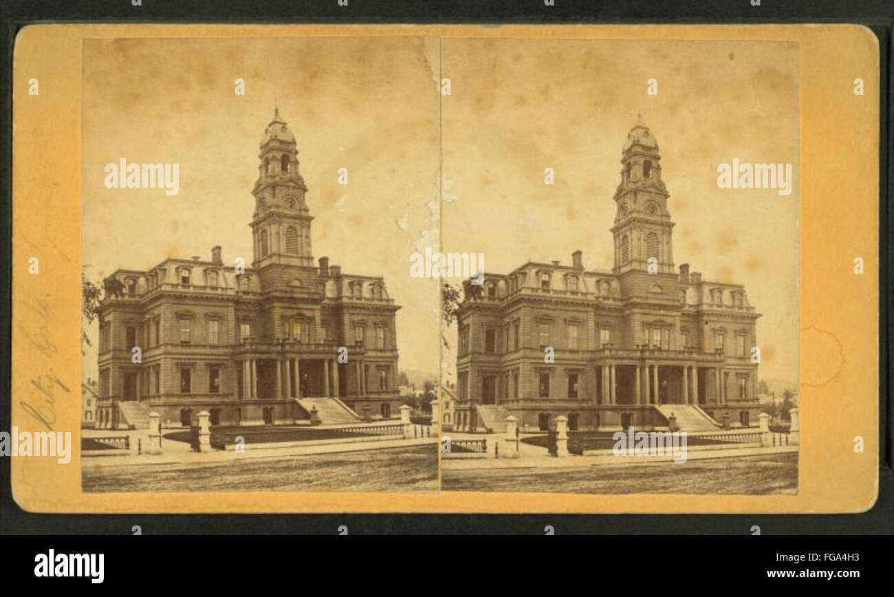 This photograph shows the City Hall building, showcasing its ...