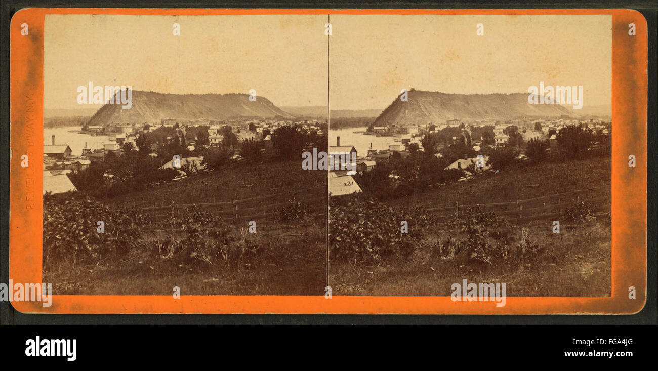 This photograph captures the city of Red Wing with Barn Bluff in the ...