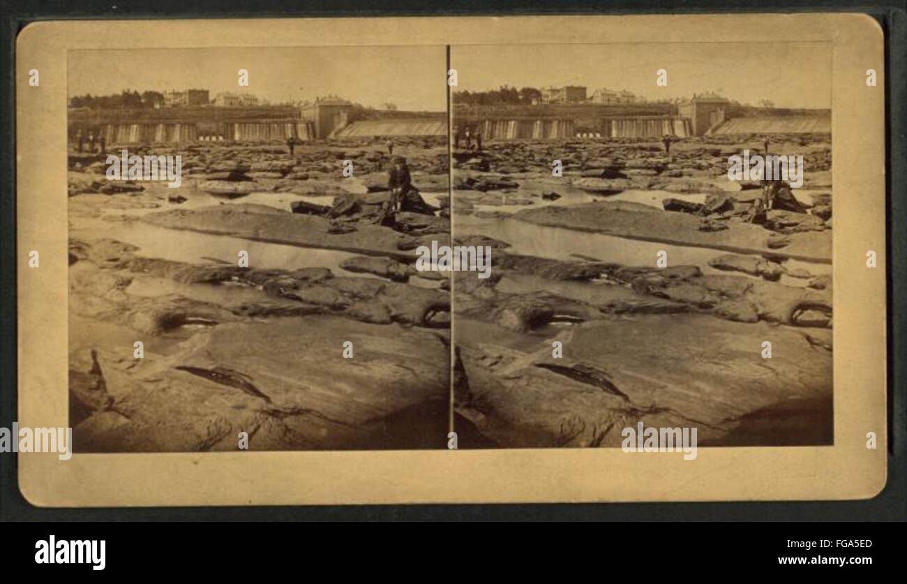 A photograph of the Connecticut River Dam at low water levels, with ...
