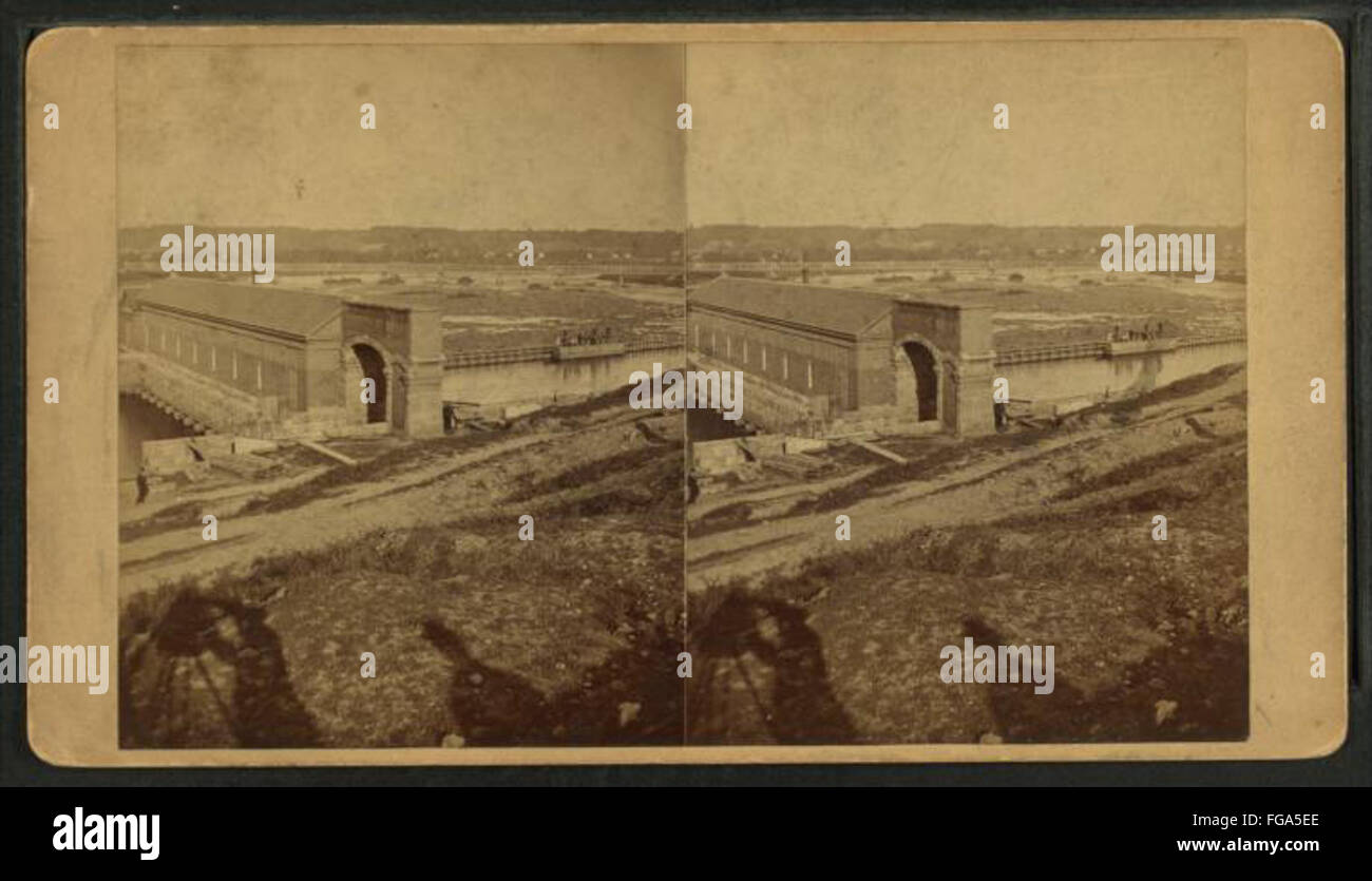 Photograph of the Connecticut River Dam with a bridge in the background ...