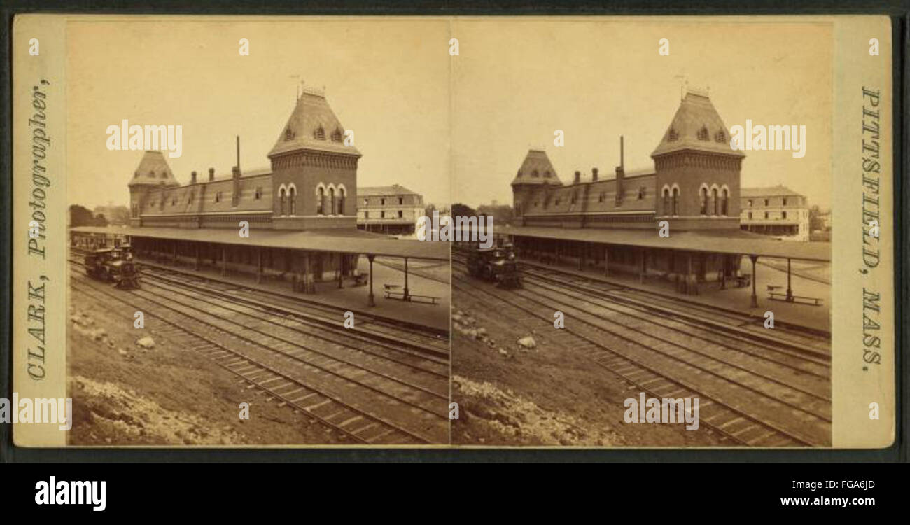 This photograph by F. Clark shows a train depot, emphasizing the ...