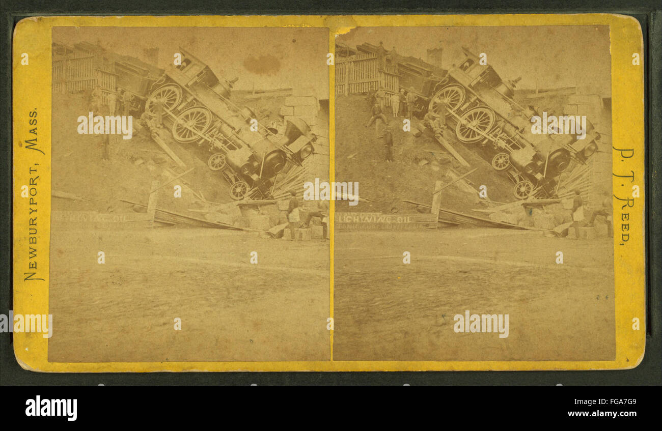 A photograph by D.T. Reed showing a derailed engine at a bridge ...