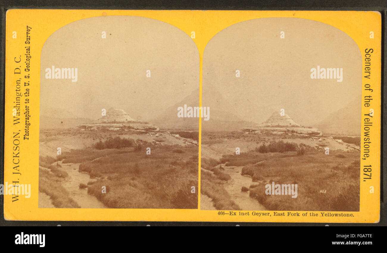 A photograph of an extinct geyser in the east fork of the Yellowstone ...