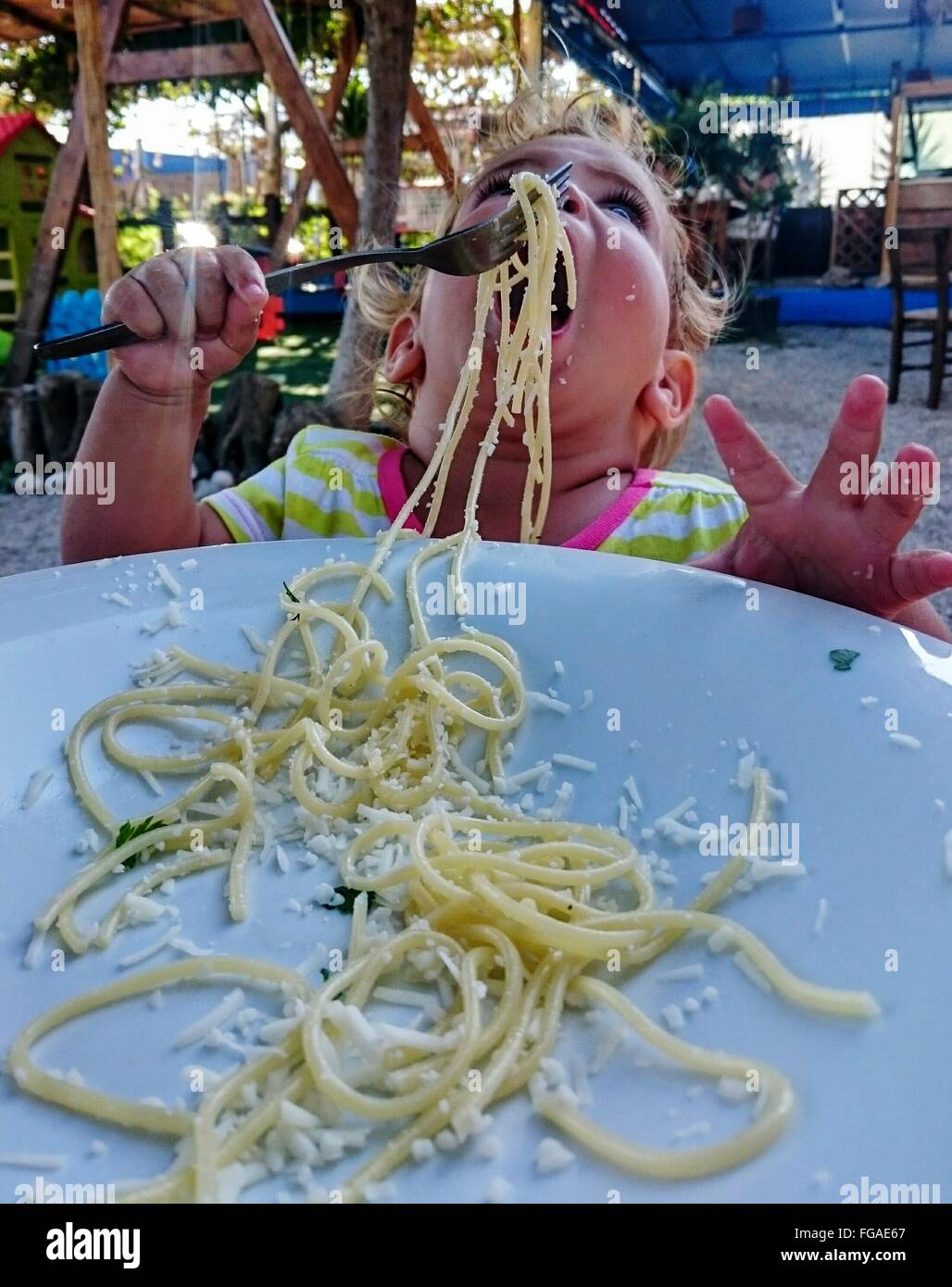 Child eating pasta hi-res stock photography and images - Alamy