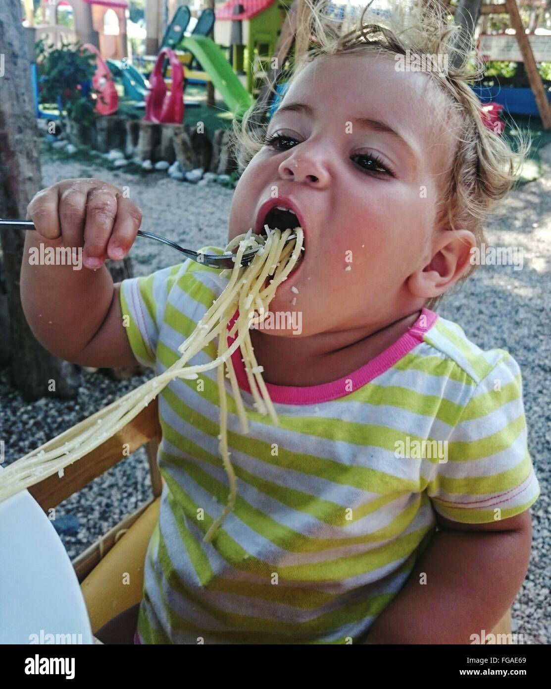Child eating pasta hi-res stock photography and images - Alamy