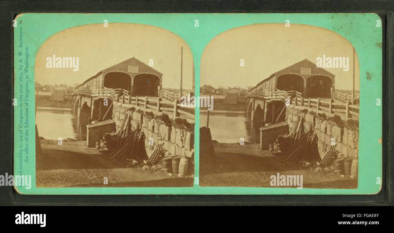 A photograph by A. W. Anderson depicting a long covered bridge crossing ...