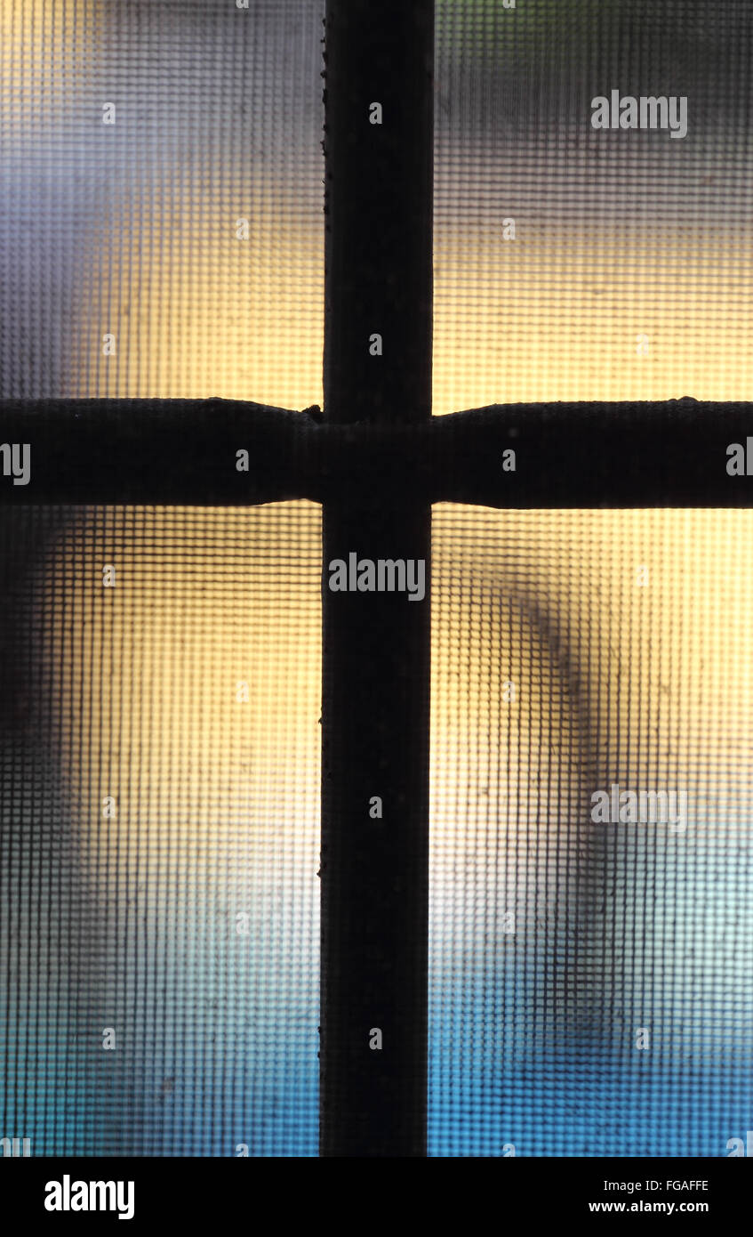 windows detail, mosquito net and cross symbol Stock Photo - Alamy