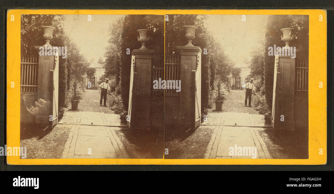 This photograph shows the main entrance of a building, emphasizing the ...