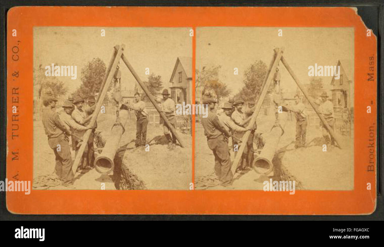 A photograph by A.M. Turner showing men laying pipe, capturing the ...