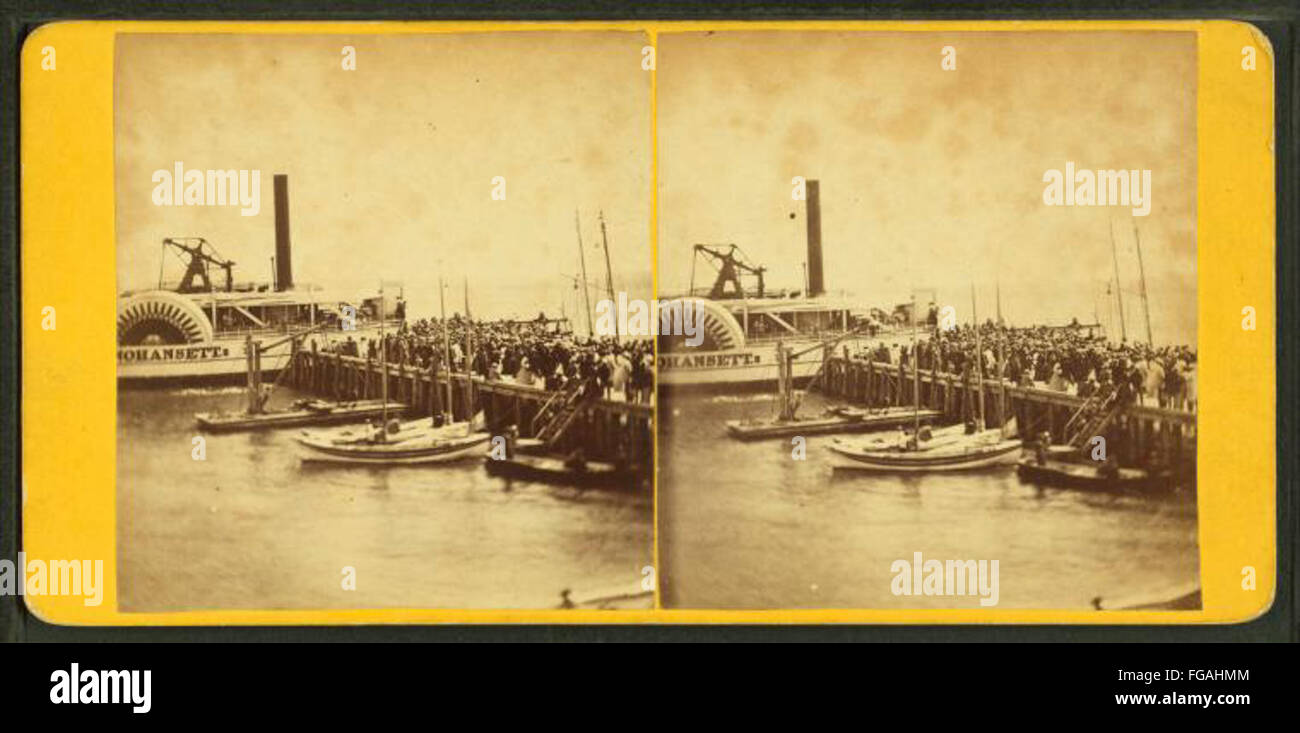This photograph by Brownell & Adams shows the Monohassett at a wharf ...