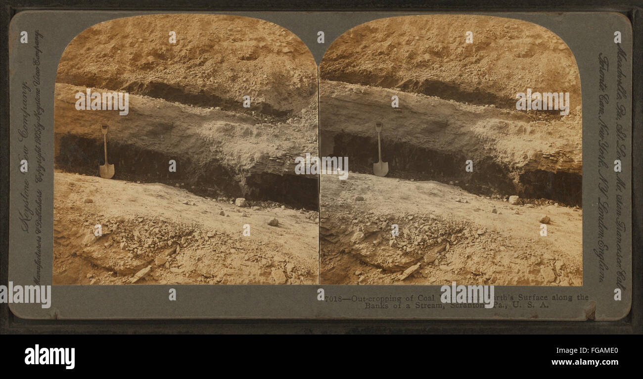 Photograph of coal veins visible near the surface along a stream in ...