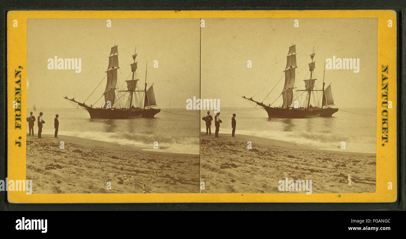 A photograph by Josiah Freeman depicting people standing on the shore ...