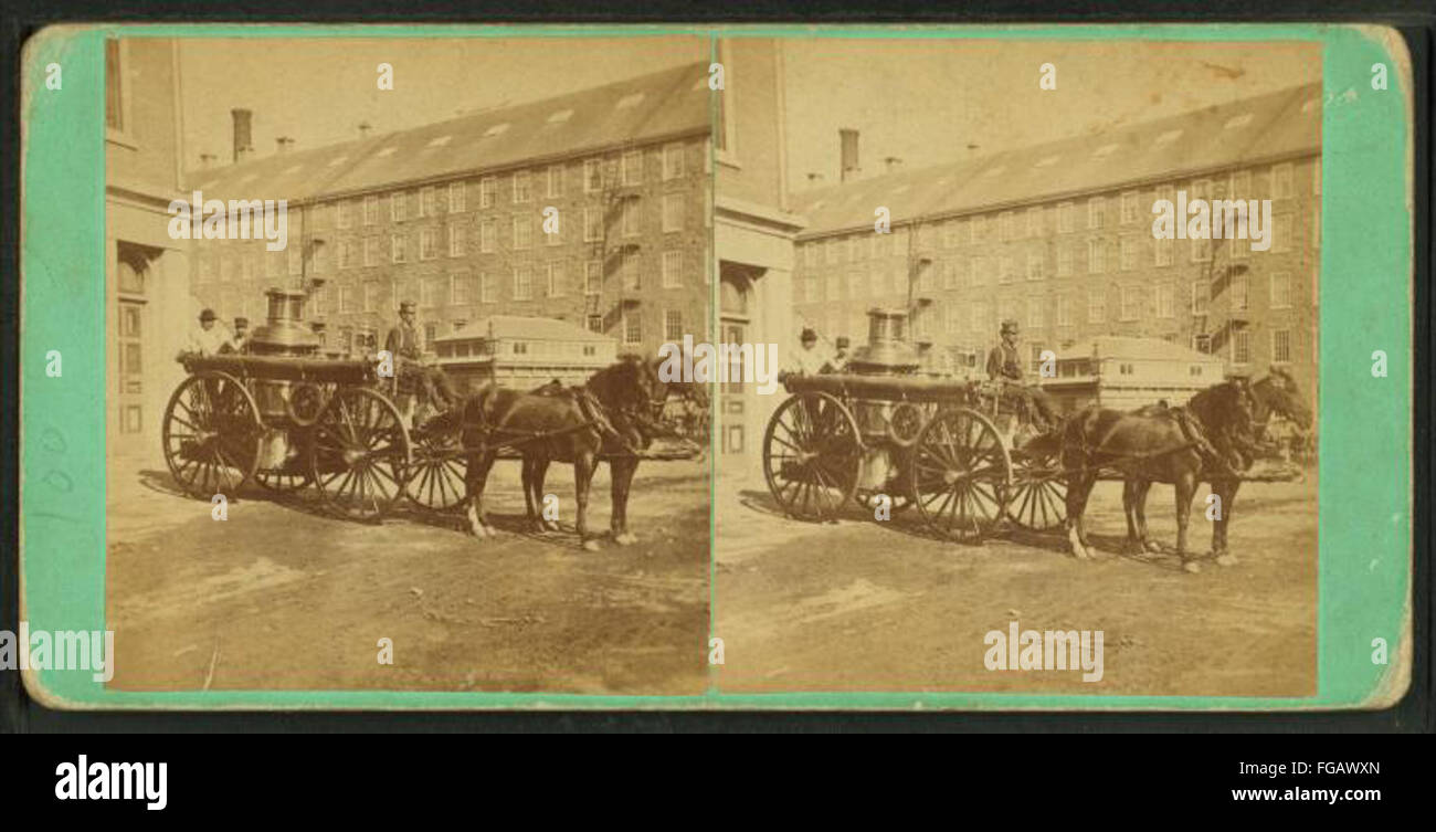 A photograph by Joseph H. Warren showing a steam pumper mounted on a ...