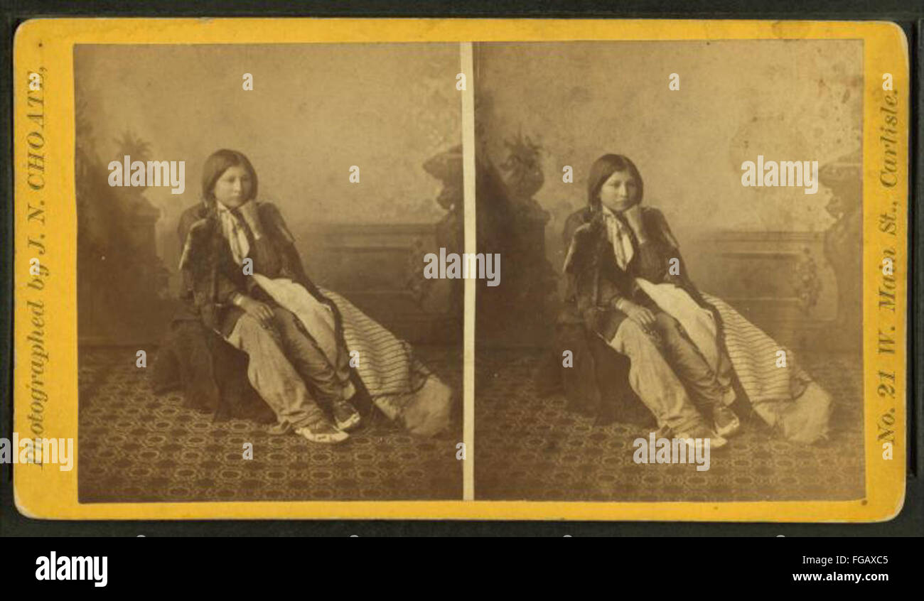 A studio portrait of a young Native American woman dressed in ...