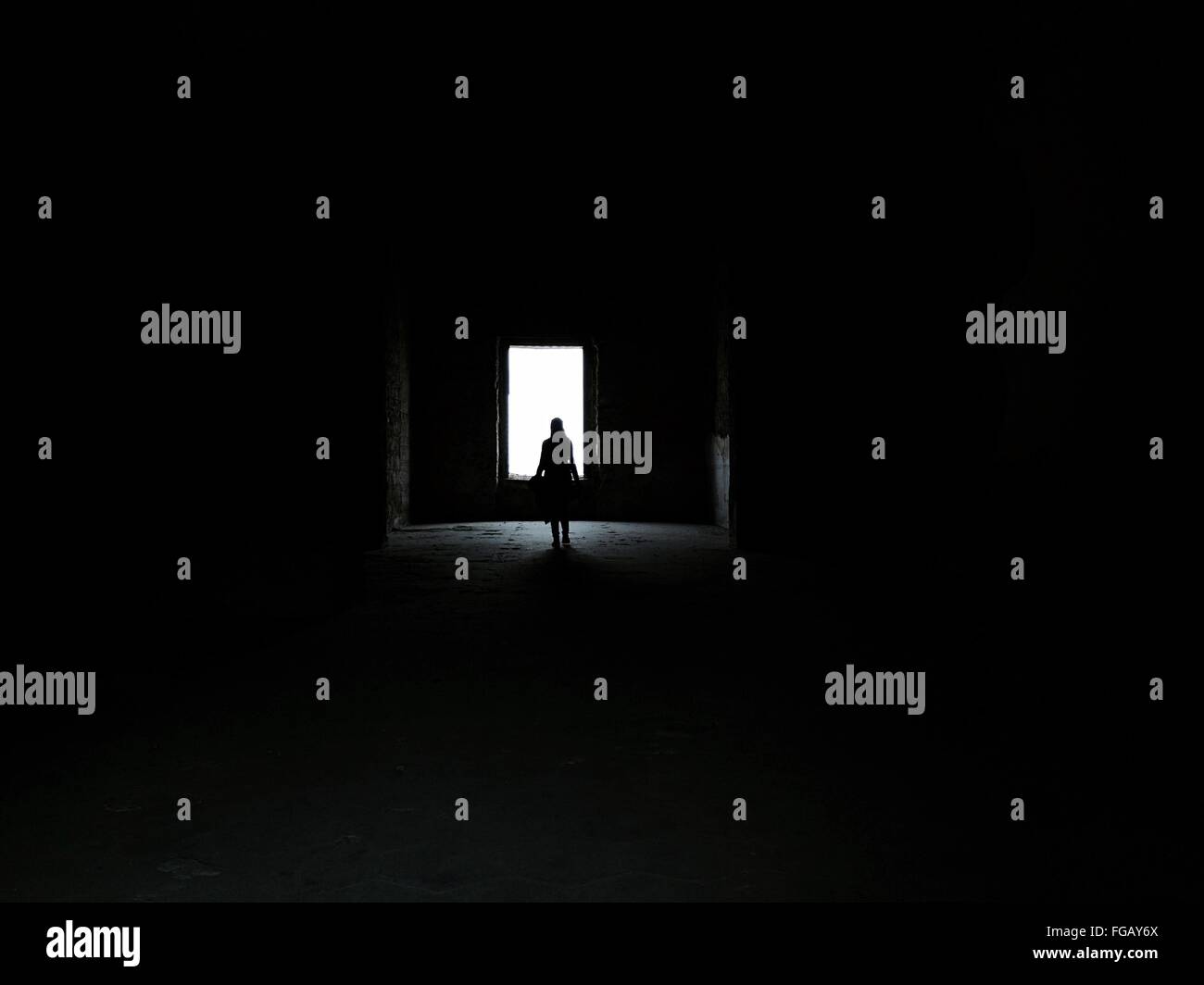 Woman Walking Towards The Light High Resolution Stock Photography and ...