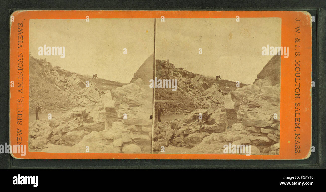 The photograph depicts a gap in the dam, showcasing the engineering and ...
