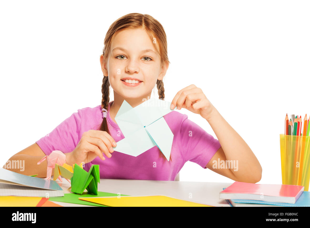 Schoolgirl with paper origami fan in her hand Stock Photo - Alamy