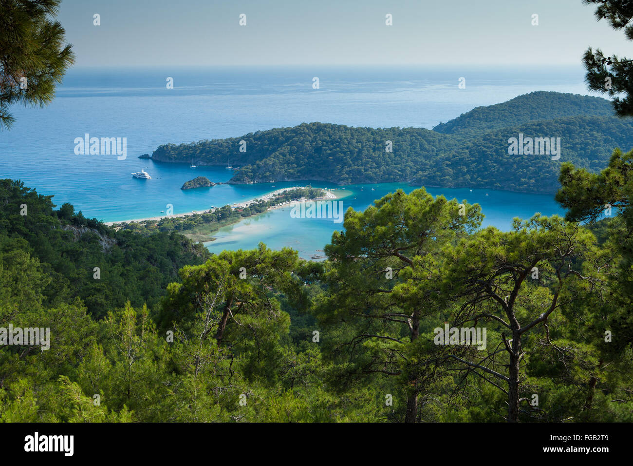 A aerial view through the pine trees of Olu Deniz and the blue lagoon ...
