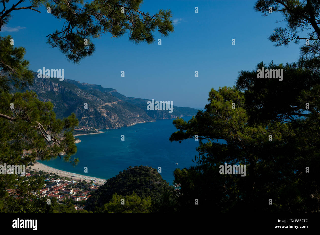 A aerial view through the pine trees of Olu Deniz and the blue lagoon ...