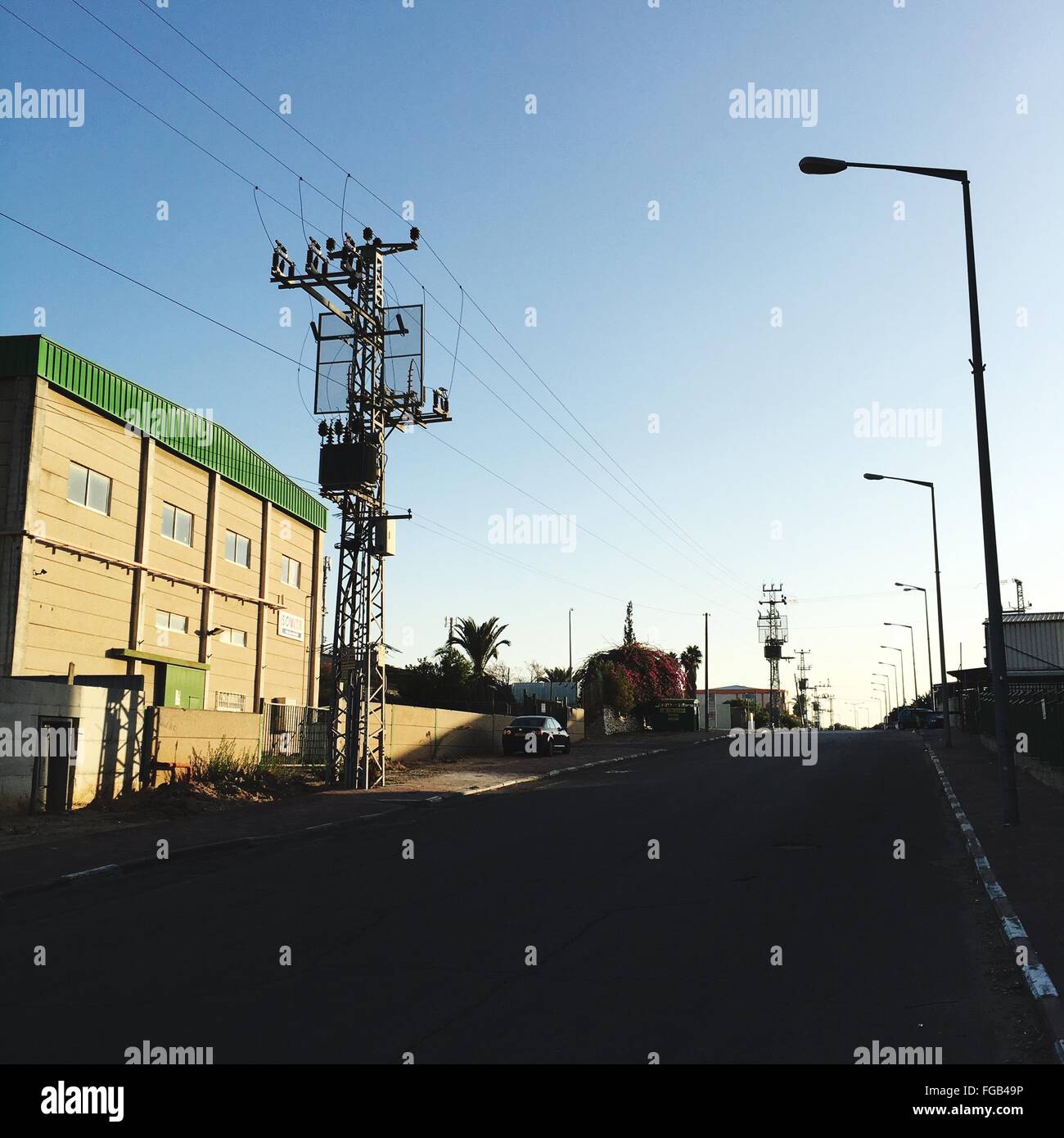 Low Angle View Of Street Lights And Electricity Pylon Against Clear Sky ...