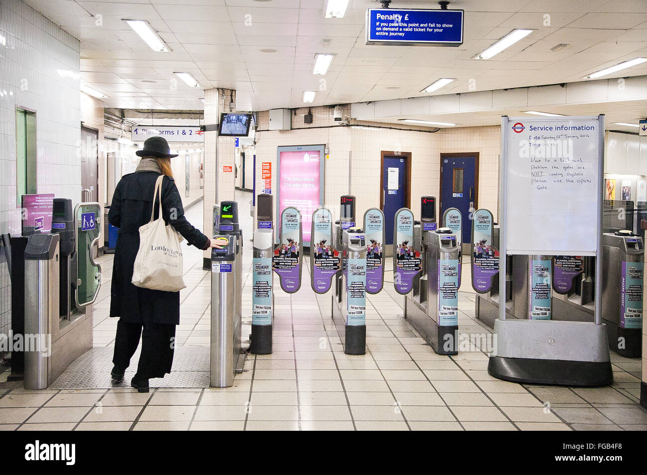 Commuter at ticket barrier at Seven Sister Underground tube station in ...