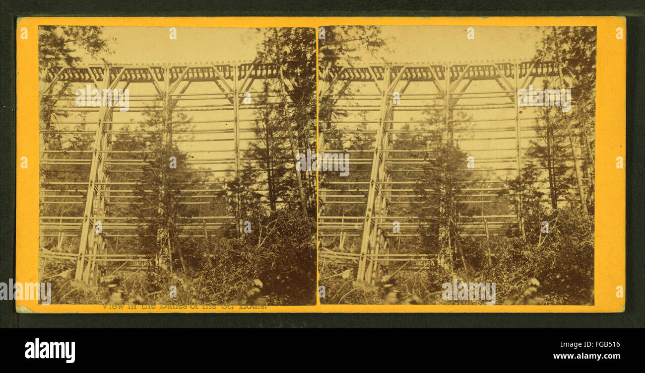 A photograph by Gaylord & Thompson showing a railroad bridge from a low ...