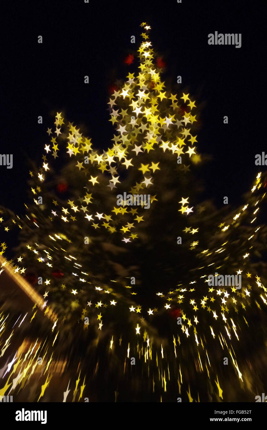 Defocused Image Of Illuminated Star Shape Lights On Christmas Tree Stock Photo - Alamy