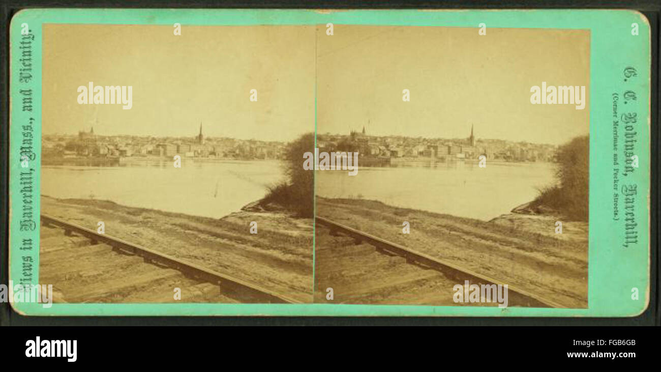 View of railroad tracks with river and city beyond, by Godfrey Clive ...