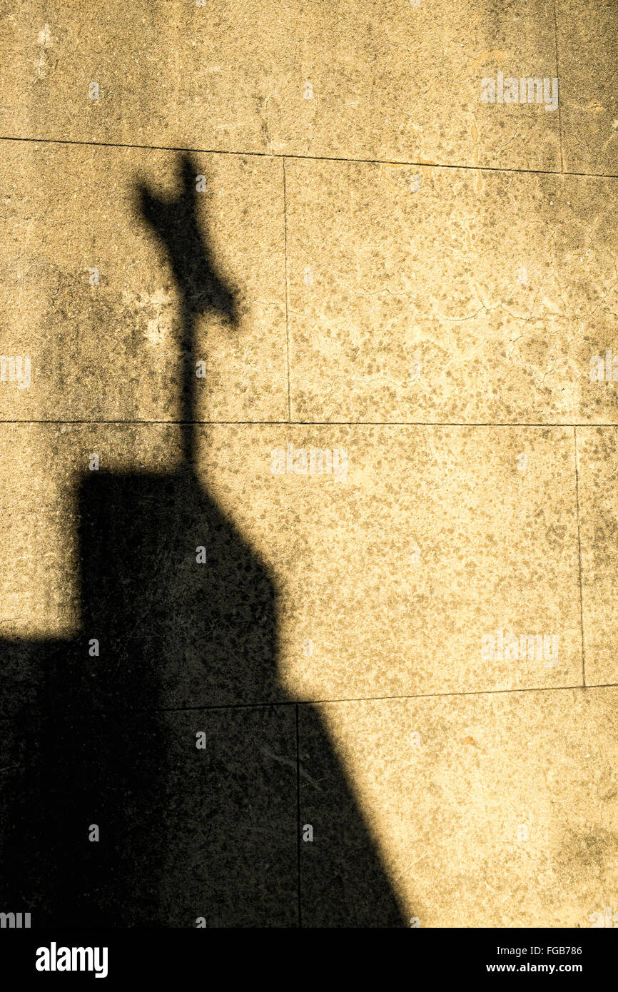 Shadow of a cross on a cemetry wall Stock Photo - Alamy