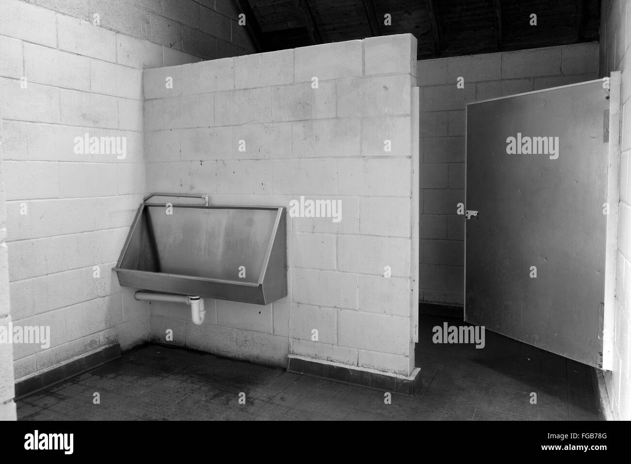 A utilitarian public mens stainless steel urinal trough 18th February ...