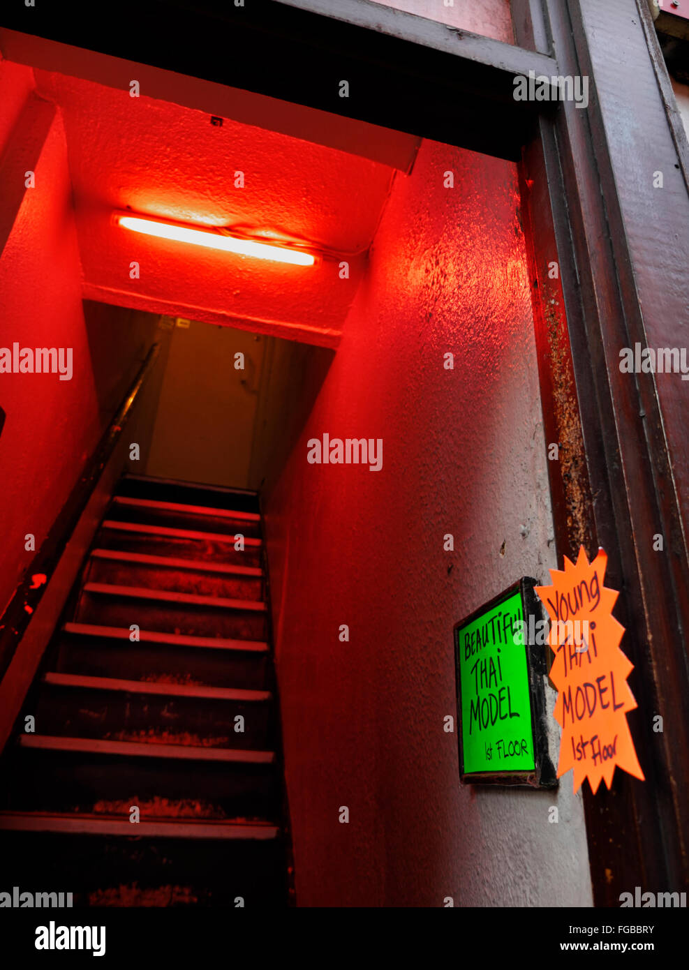 Prostitution seedy brothel entrance with worn stairway leading up to ...