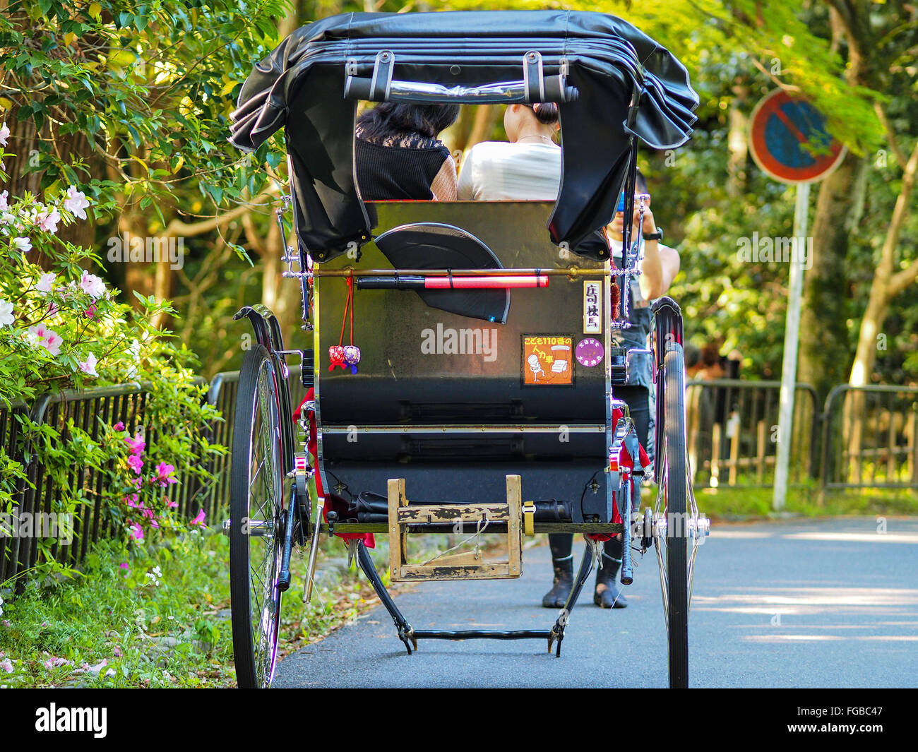 Man Photographing People Sitting In Rickshaw On Road Stock Photo - Alamy