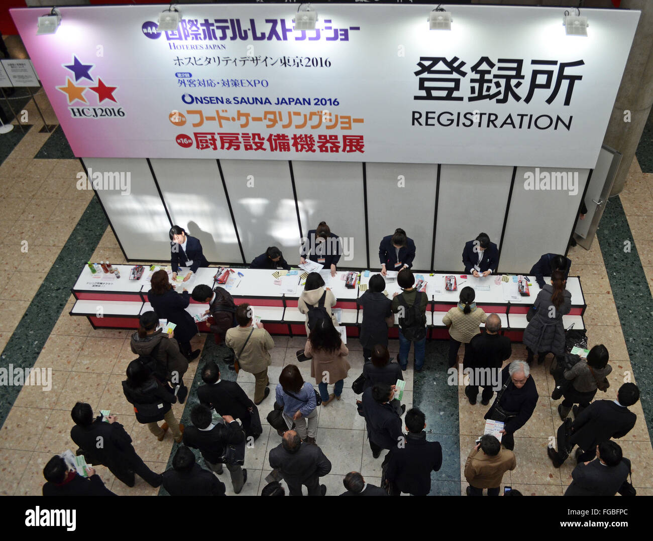 Tokyo, Japan. 16th Feb, 2016. Attendees line up to register at the ...