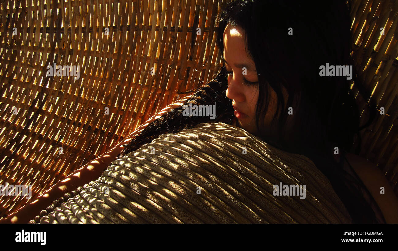 Young Woman Sleeping On Wicker Chair Stock Photo - Alamy