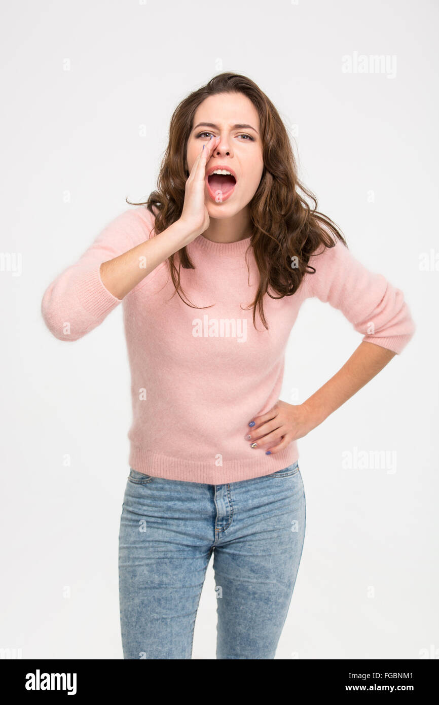 Young woman shouting isolated on a white background Stock Photo - Alamy