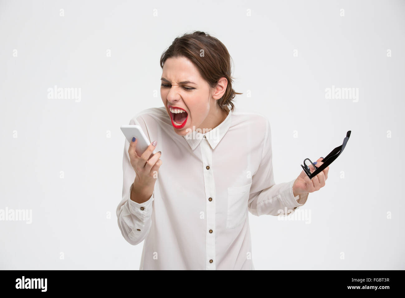 Woman cell phone shouting hi-res stock photography and images - Alamy